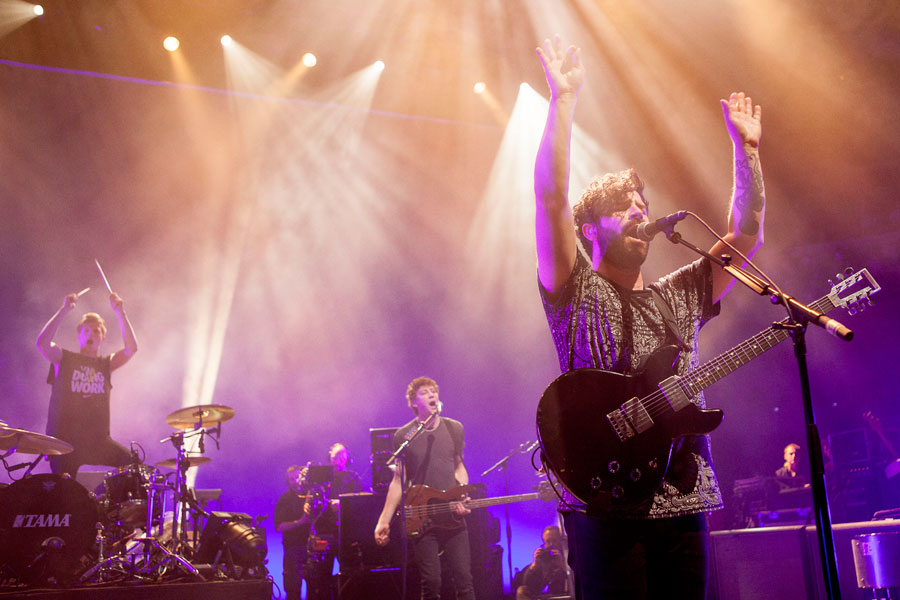Foals' Yannis Philippakis dives off balcony during Dublin gig – watch